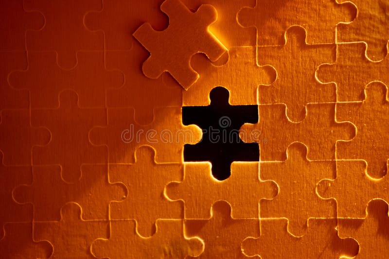Pieces of a Jigsaw Puzzle Filled with Orange Lights by Hand Success ...