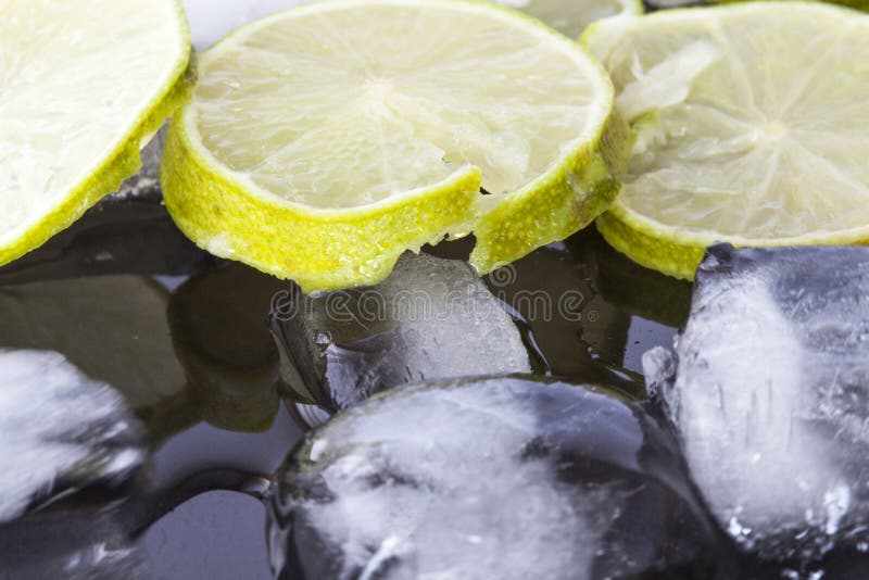 Pieces of lime on ice stock image. Image of frozen, lime - 39126691