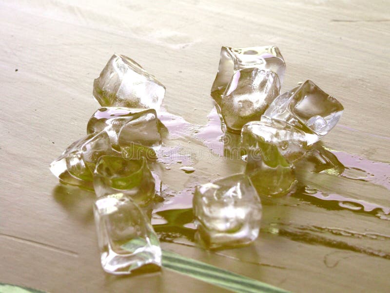 Pieces of Melting Ice on the Table Stock Photo - Image of piece, pieces ...