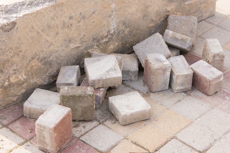 Pieces of Old Paving Slabs Lie in Concrete Block on the Pavement Stock ...