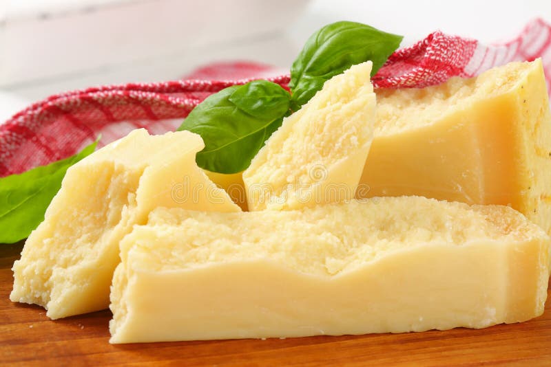 Pieces of Parmesan cheese stock image. Image of closeup - 76039971