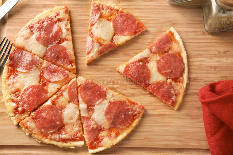 Pieces of Pepperoni Pizza on Wooden Board Stock Photo - Image of ...