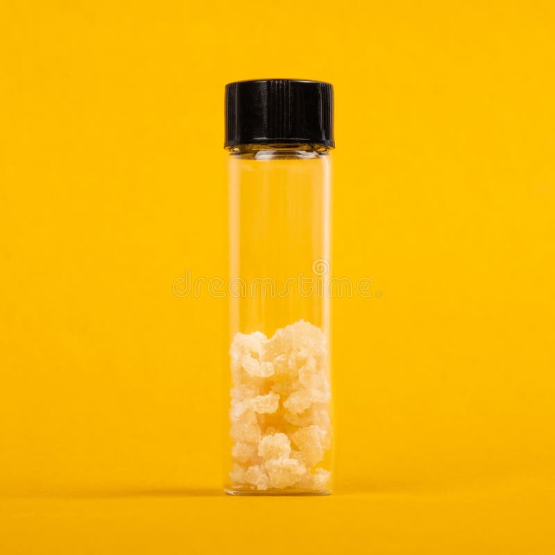 A Pieces of Pure Hash Dab Crystal Cannabis on Yellow Background Stock ...