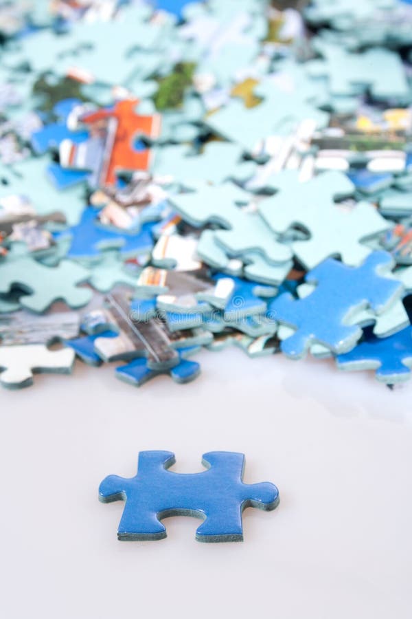 Pieces of Puzzle Spilled on Table Stock Image - Image of abstract ...