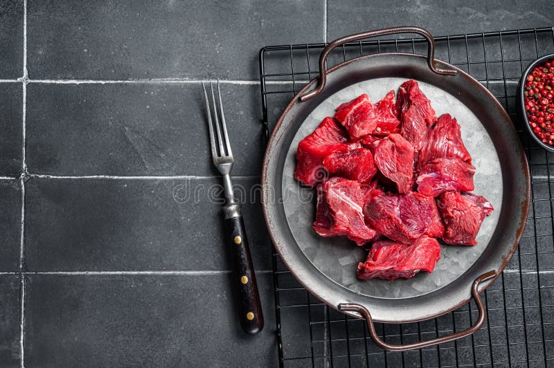 Pieces of Raw Diced Beef Fillet Meat. Black Background. Top View Stock ...