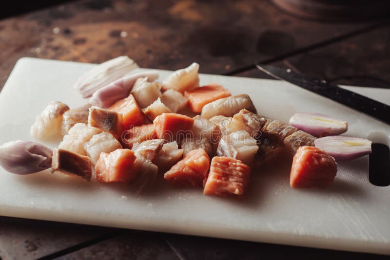 Pieces of Raw Fish Cut on a Cutting Board. Red and White Fish Stock ...