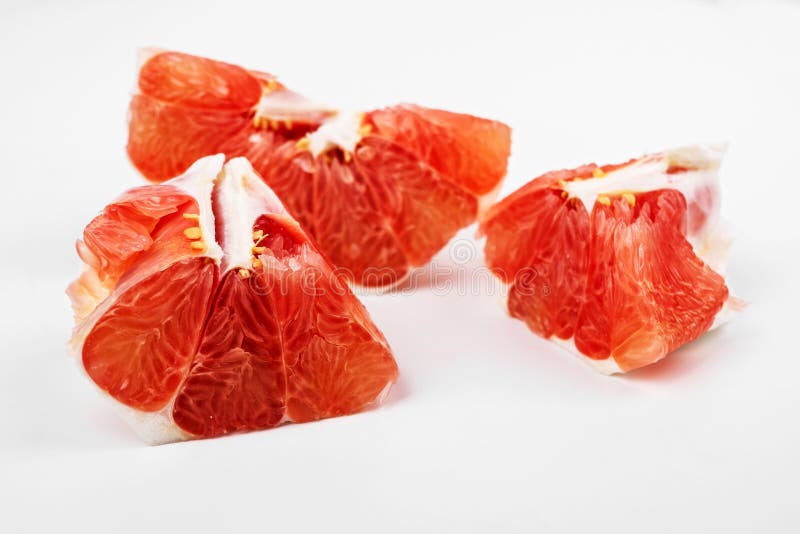 Pieces of Red Grapefruit on White Background Stock Image - Image of ...