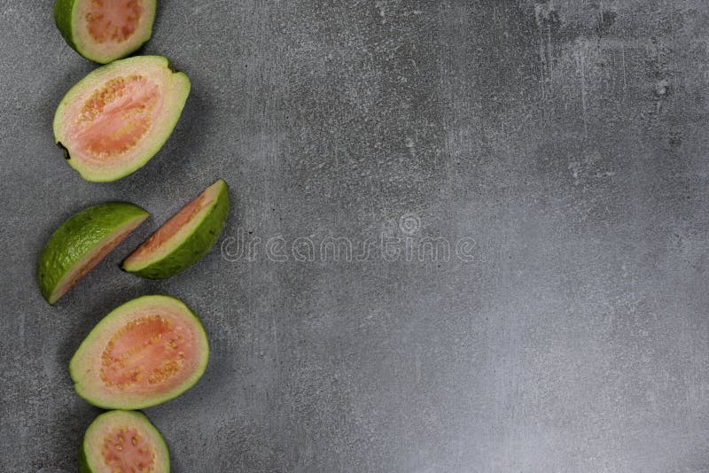 Pieces of Red Guava on Concrete. Concrete Texture Stock Photo - Image ...