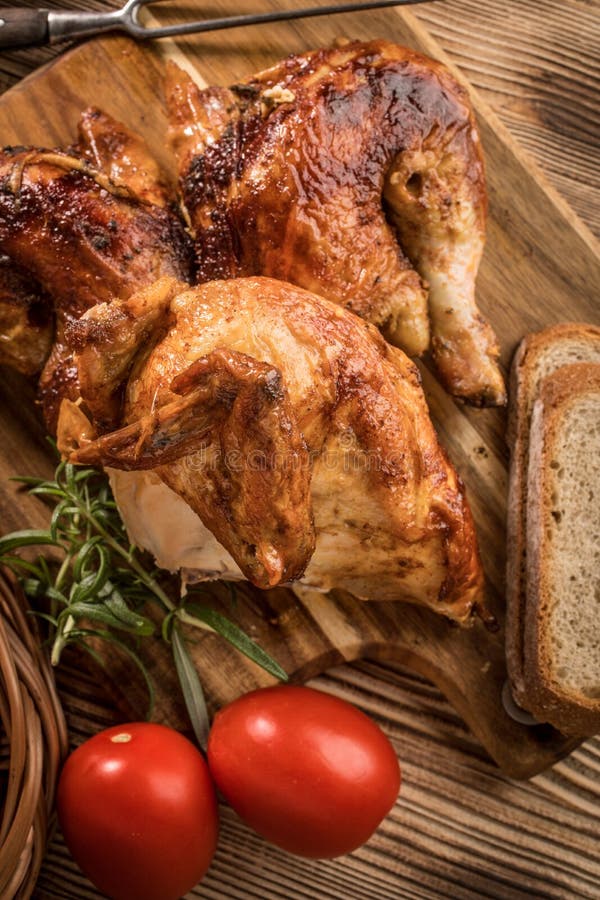 Pieces of roasted chicken stock image. Image of board - 176760737