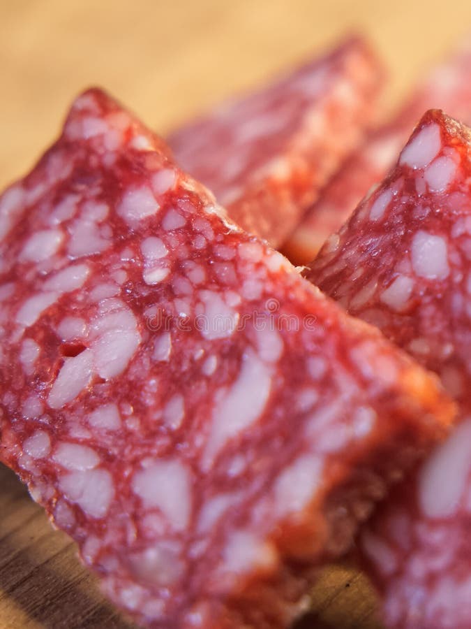 Pieces of Salami Sausage, Close-up. Delicious Meat Appetizer Stock ...