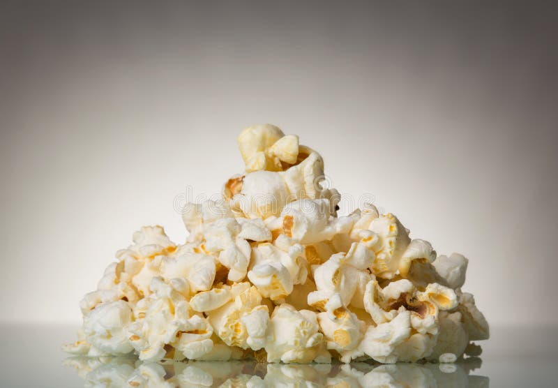 Pieces of Salty Popcorn on a Gray Stock Photo - Image of film, golden ...