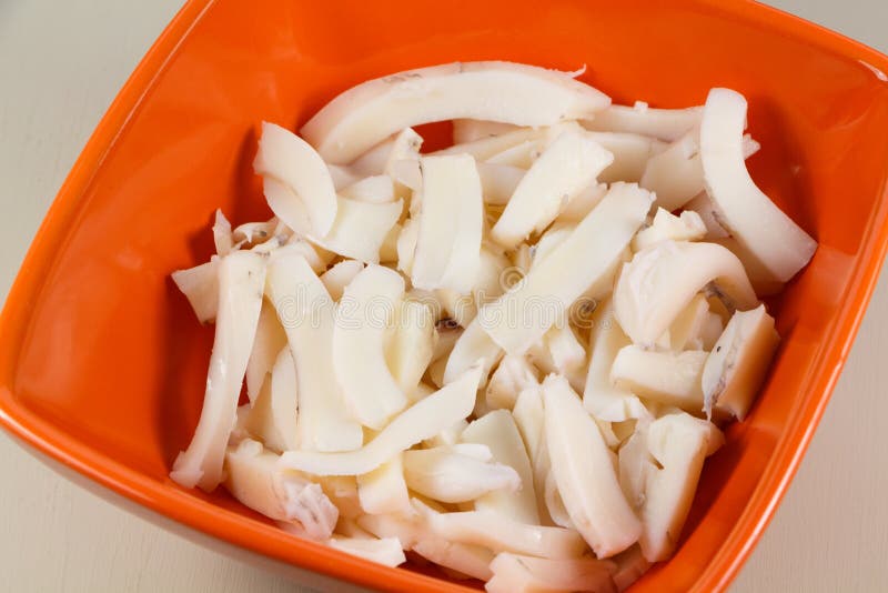 Pieces of squid in a bowl stock image. Image of food - 200193839
