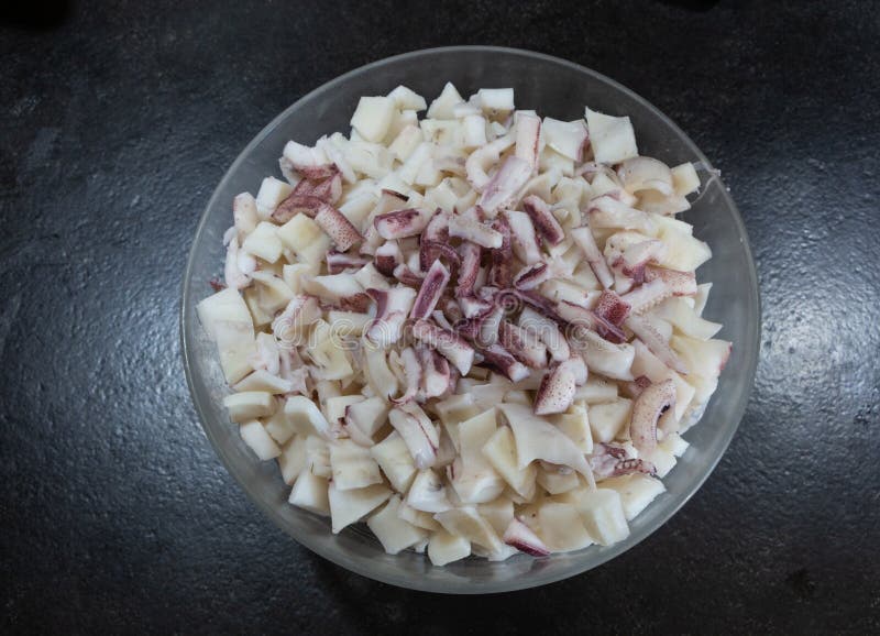 Pieces of squid in a bowl stock image. Image of marine - 182997009
