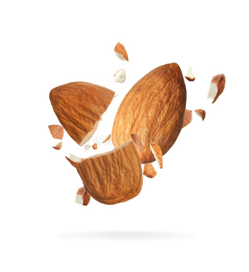 Pieces of Tasty Almonds Falling on White Background Stock Photo - Image ...
