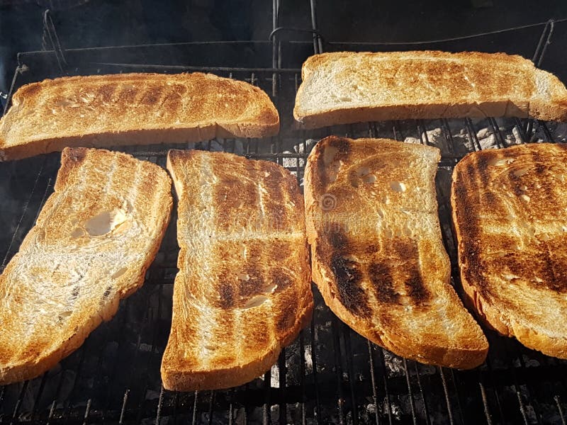 Toasted Bread Over Low Fire Stock Photo - Image of bread, pieces: 105339926