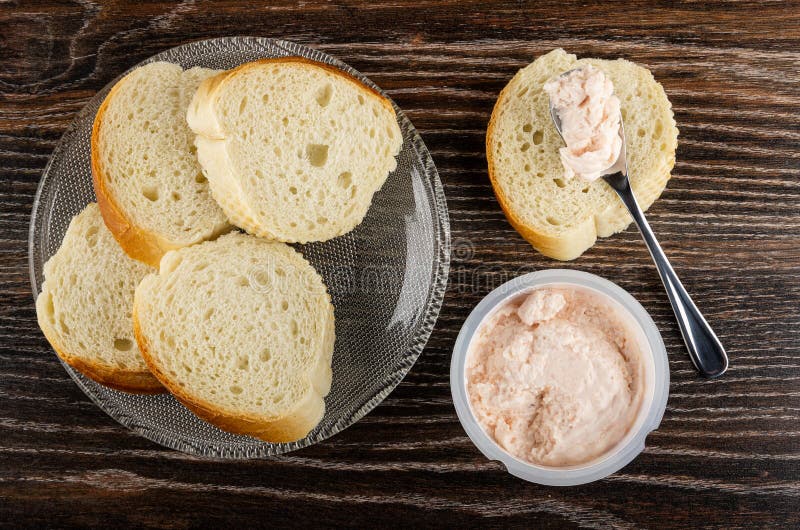 Pieces of Bread in Plate, Jar with Krill Paste, Spoon with Paste on ...