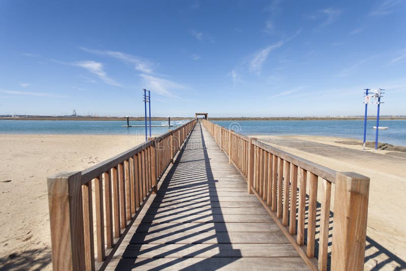 Pier in a beach stock photo. Image of dock, jetty, beach - 26272506