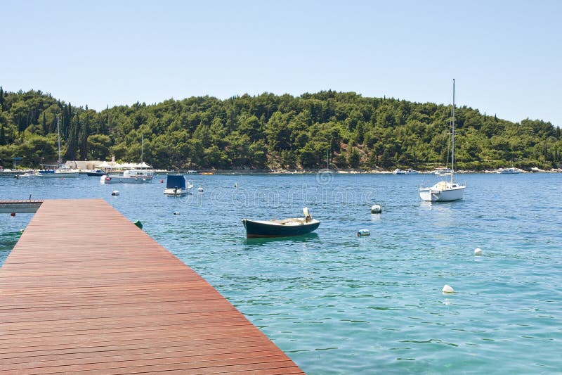 Pier into Blue Harbor stock image. Image of peaceful - 11229643