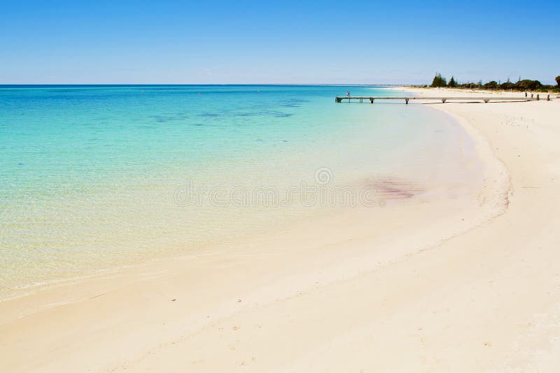 Pier in Blue Water of the Ocean Shore Stock Photo - Image of bright ...