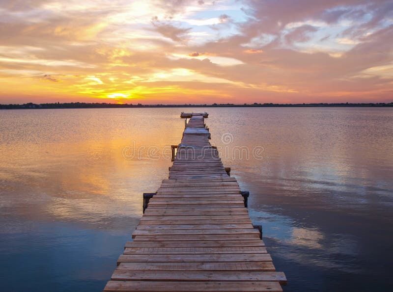 Pier (dock) on a sunset stock photo. Image of summer - 76736546