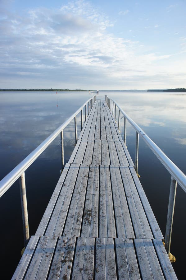 Pier in the early morning stock photo. Image of water - 33424416
