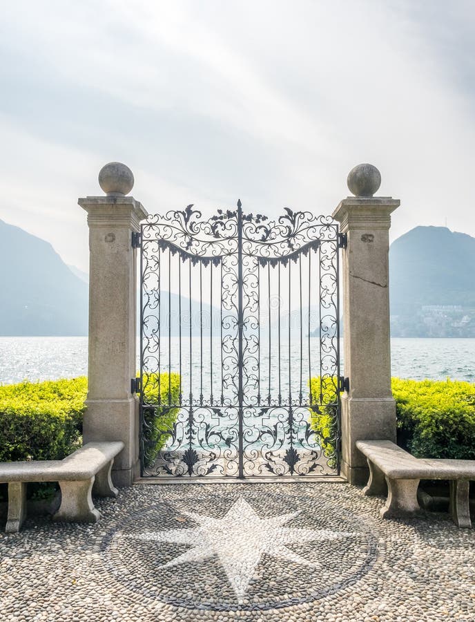 Pier gate in Lake Lugano stock image. Image of star, lugano - 91729199