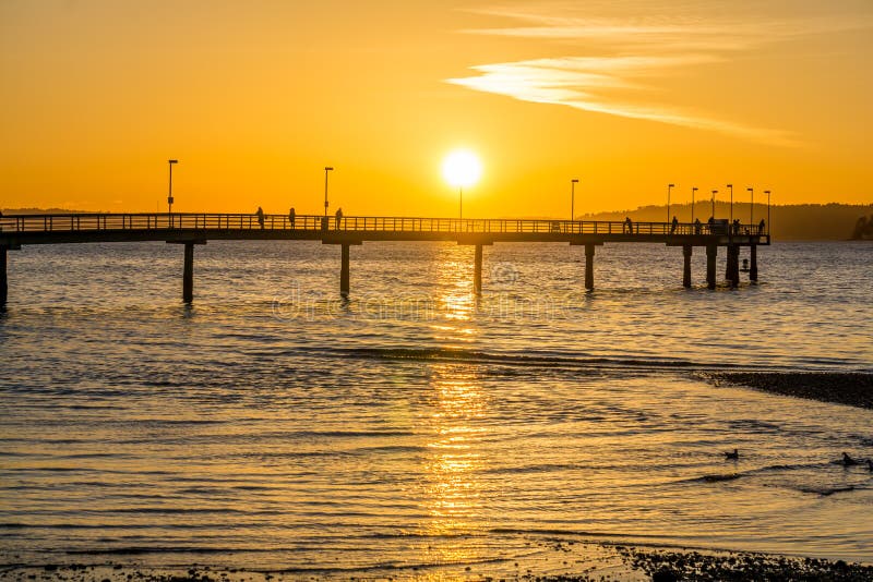 Pier and Golden Sky 4 stock image. Image of evening - 206580513