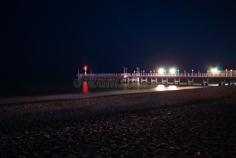 The Pier is Illuminated by Night Lights. Stock Photo - Image of city ...
