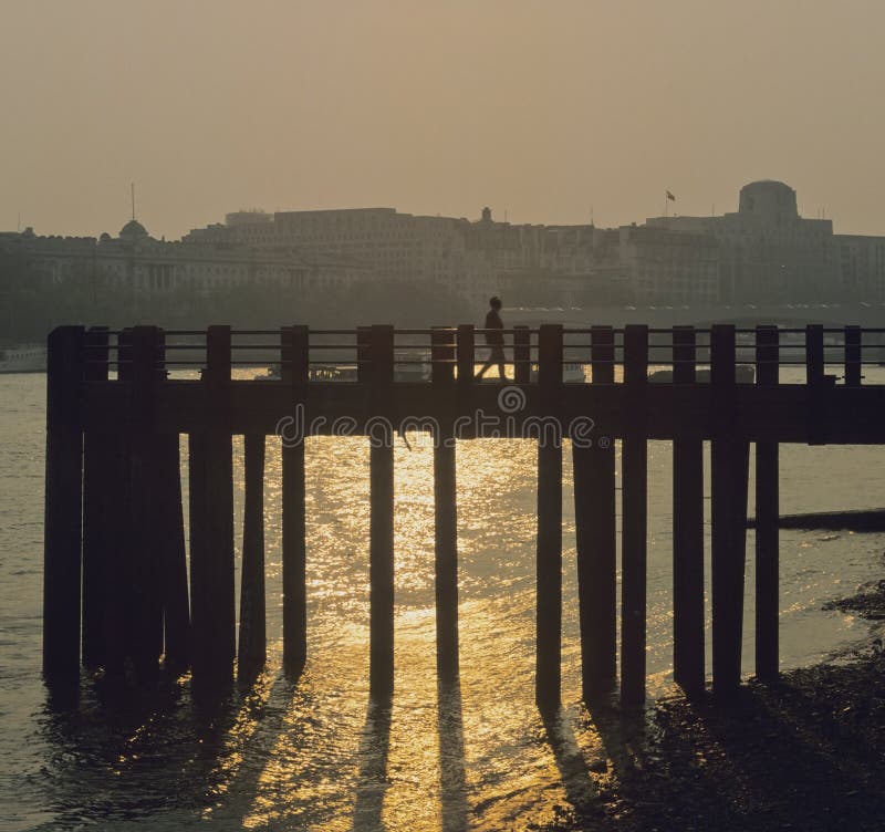 Pier or Jetty Silhouette in a Foggy Lake. Garda Lake, Italy Stock Photo ...