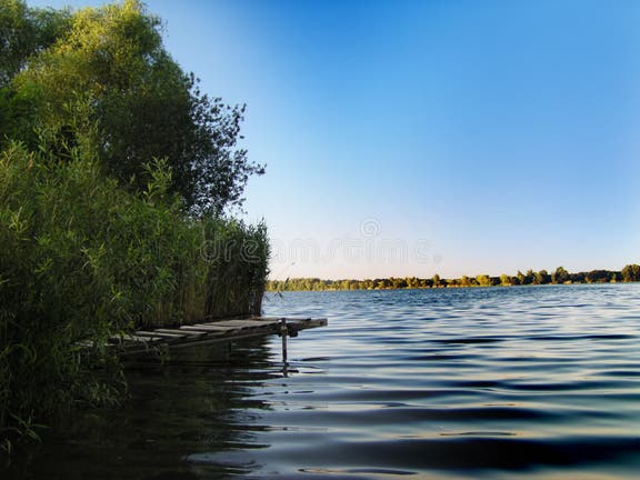 Pier in the lake stock image. Image of alone, mirror, outdoor - 1312099