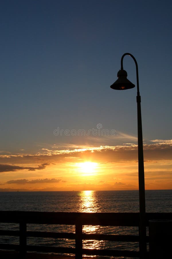 Pier Lamp Post Sunset stock photo. Image of sunset, reflection - 47322