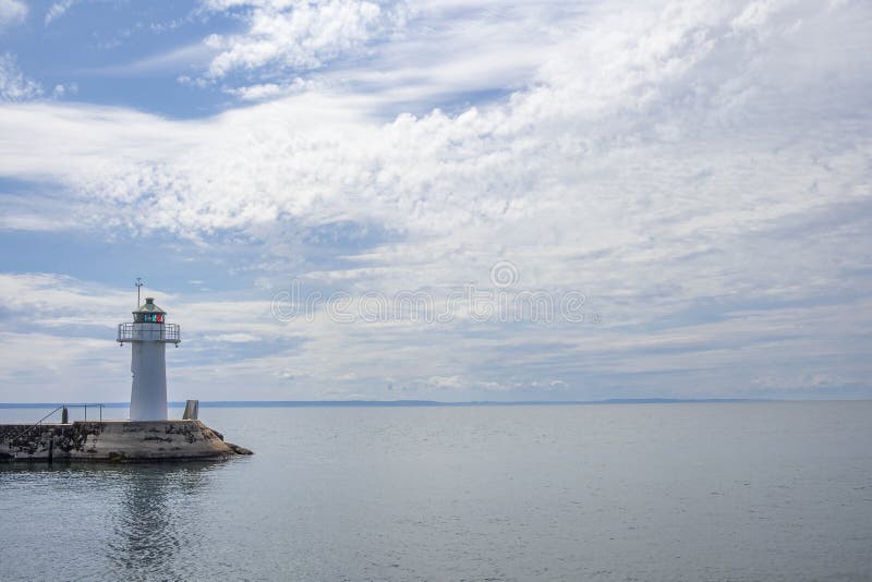 Lighthouse on the Water Edge Near Sea Stock Photo - Image of evening ...