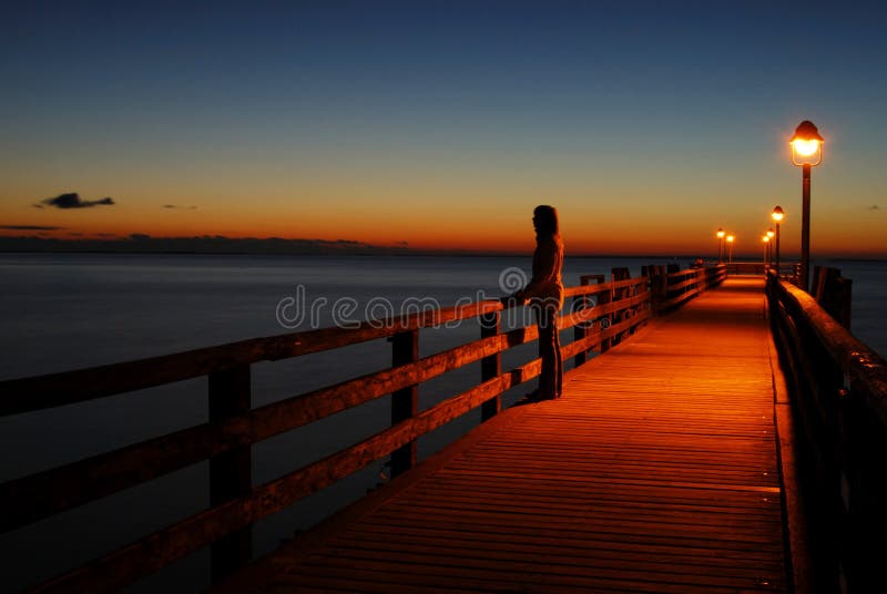 Pier at night stock photo. Image of night, person, lamps - 5814848