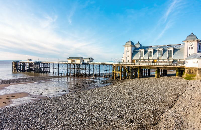 Pier and Pebble Beach stock photo. Image of landscape - 73216898