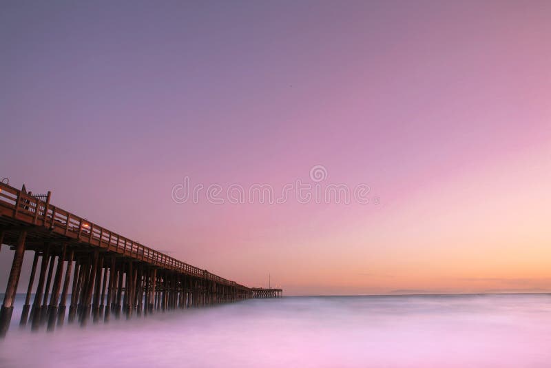 Pier at Pink Sunset stock image. Image of pier, waves - 3387023