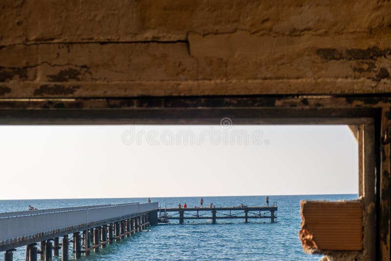 Pier through a Rusted Window Stock Image - Image of ocean, blue: 269138179
