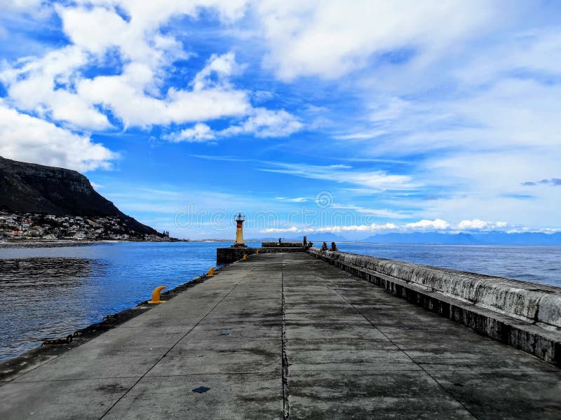 Pier at the Shore with a Lighthouse Stock Image - Image of travel ...