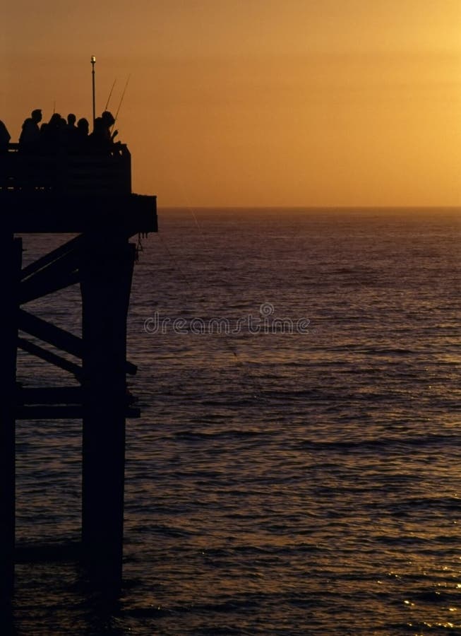 Pier at sunset stock photo. Image of fishing, reflection - 15318452