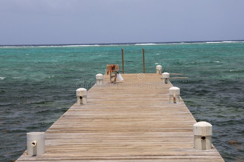 Pier Walkway Jutting Out into the Ocean Blue Stock Image - Image of ...