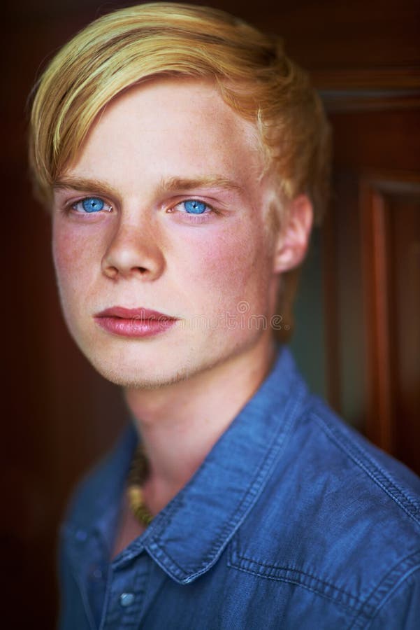 Piercing Blue Eyes. Thoughtful and Handsome Young Blonde Guy with Very ... Piercing Blue Eyes. Thoughtful and Handsome Young Blonde Guy with Very ...