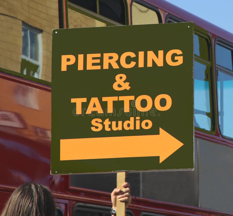 Piercing and Tattoo sign stock photo. Image of promoting - 21426508