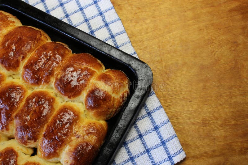 Pies on a baking sheet stock image. Image of food, brown - 64487129