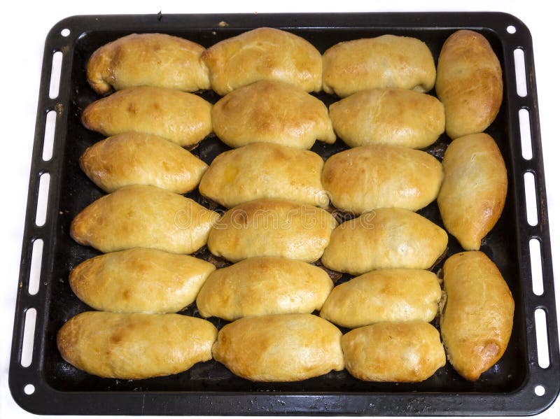 Pies on a baking sheet stock image. Image of dough, food - 69633531
