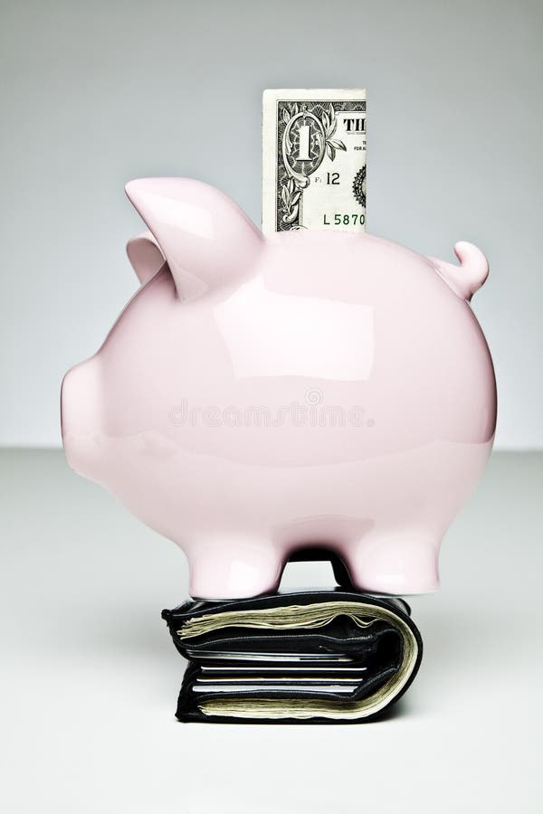 Piggy Bank on a Full Wallet Stock Photo - Image of investment, dollar ...