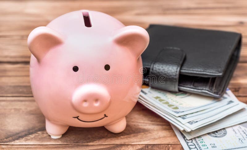 Piggy Bank with Wallet and Dollar Bills on the Table Stock Photo ...