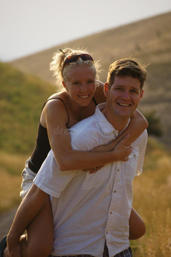 Piggyback Ride stock photo. Image of romance, road, hills - 2815386