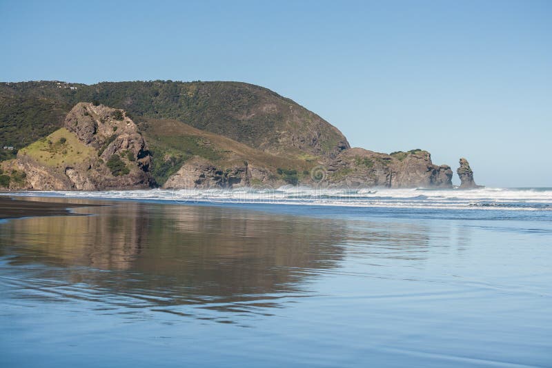 Piha beach at low tide stock image. Image of island, coastal - 53929035
