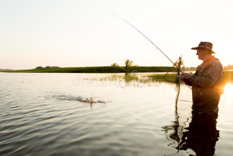 Pike hunter on the river stock image. Image of color - 97233317