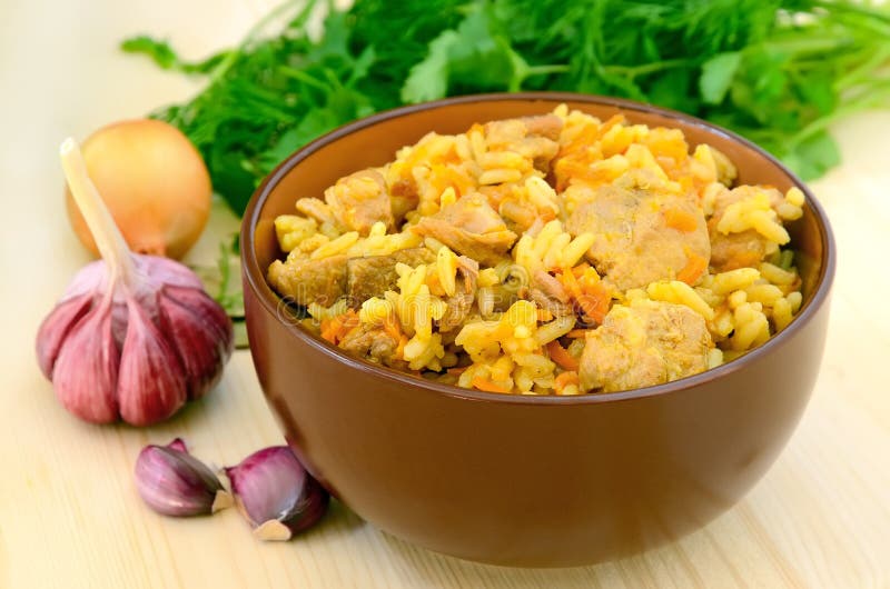 Pilaf in bowl on the table stock image. Image of garlic - 35792989