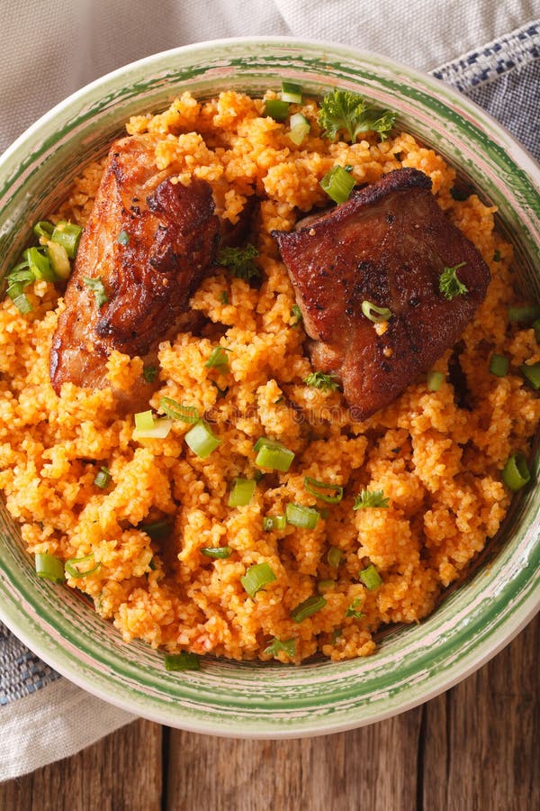 Pilaf Bulgur and Beef Close-up on a Plate on the Table. Vertical Stock ...